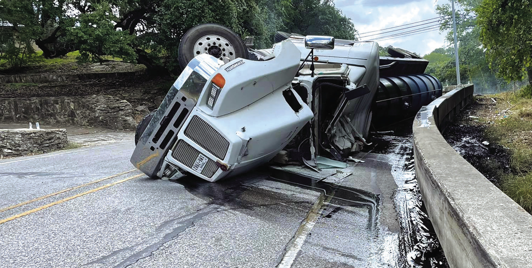 Hazardous Spill on Bluff After Truck Flips | The Fayette County Record